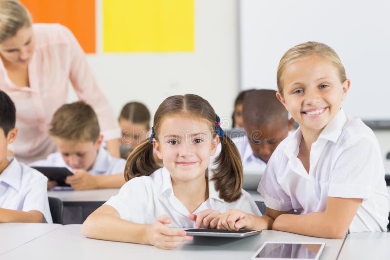 School Kids Using Digital Tablet in Classroom Stock Image - Image of ...