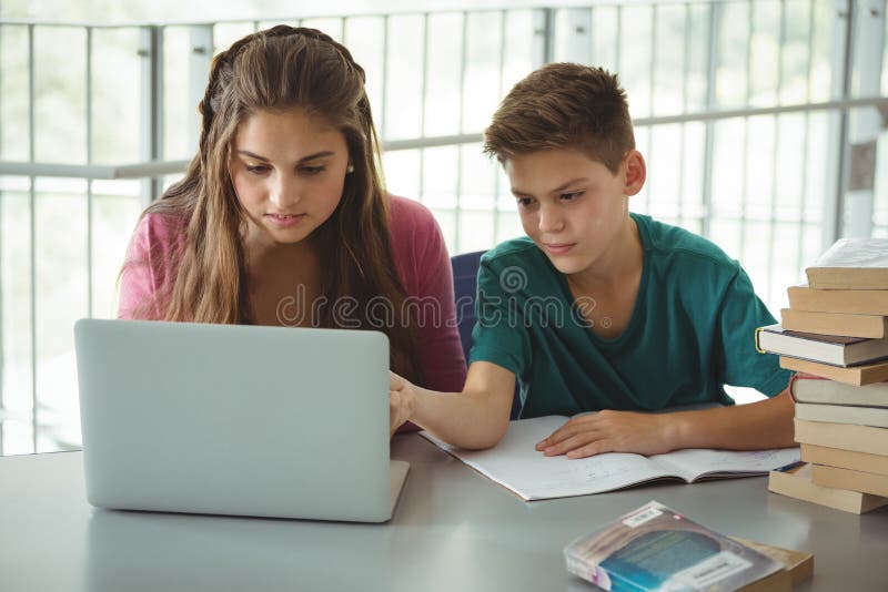 School Kids Using Laptop in Library Stock Photo - Image of electronic ...