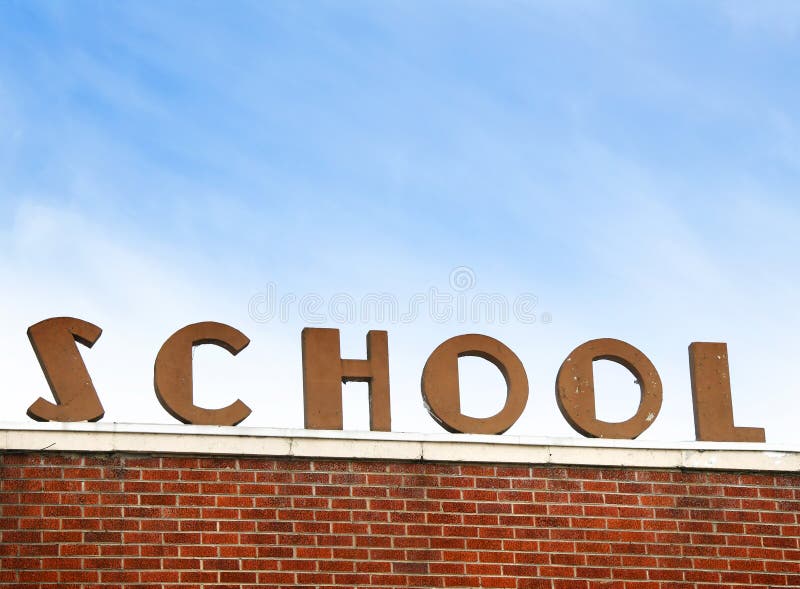 School Letters on Brick Building Stock Photo - Image of sign, building ...