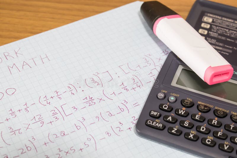 School, Math Homework with a Calculator on a Wood Table Stock Image ...