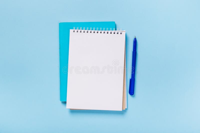 School Notebook on a Blue Background, Spiral Notepad on a Table Stock ...