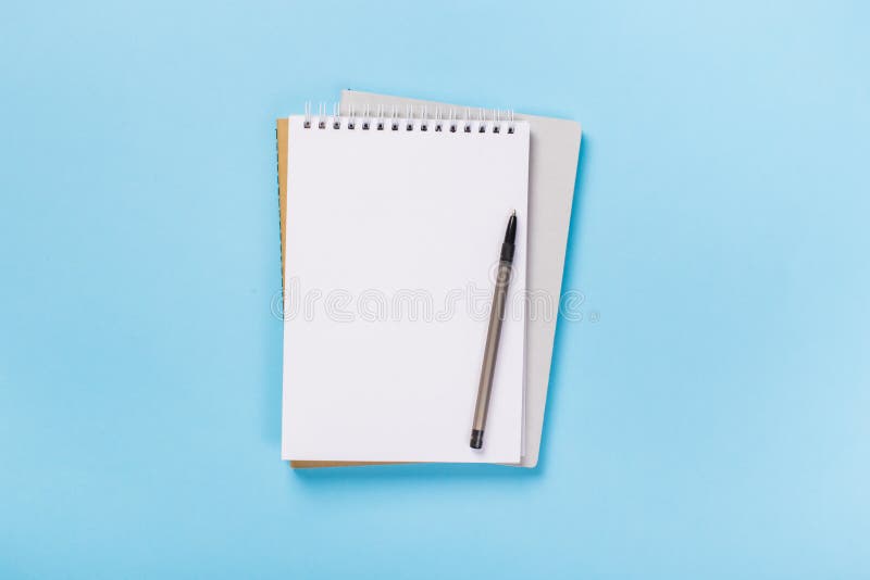 School Notebook on a Blue Background, Spiral Notepad on a Table Stock ...