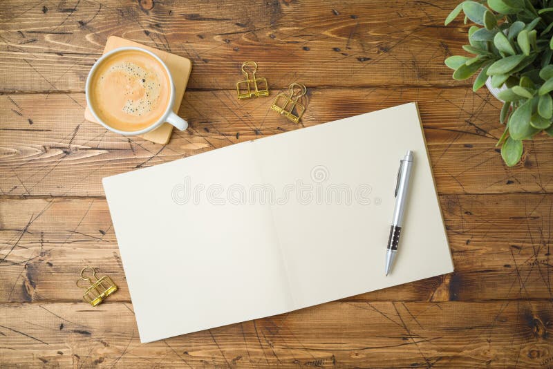School Notebook with Coffee Cup and Plant on Wooden Table. Top View ...