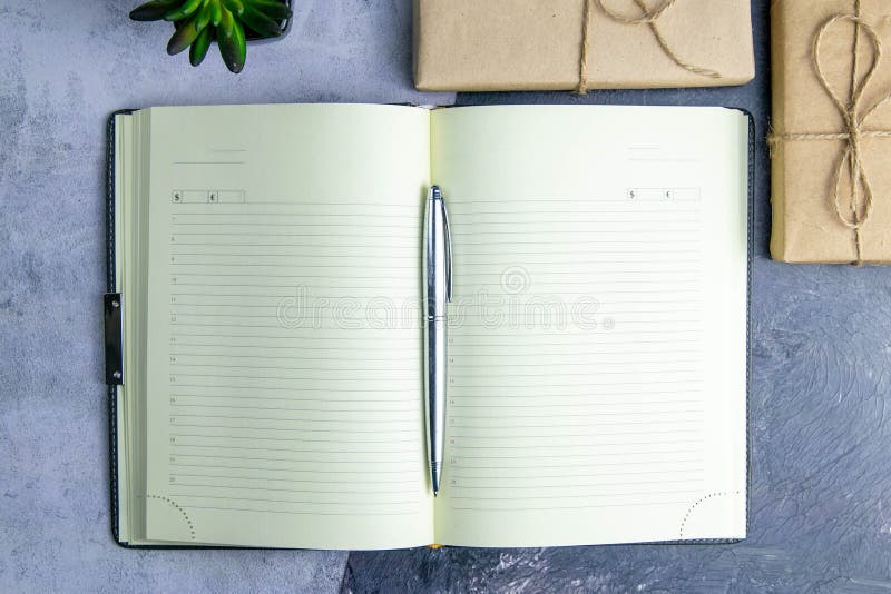 School Notebook with Gifts on a Gray Background, Gift Boxes with a ...