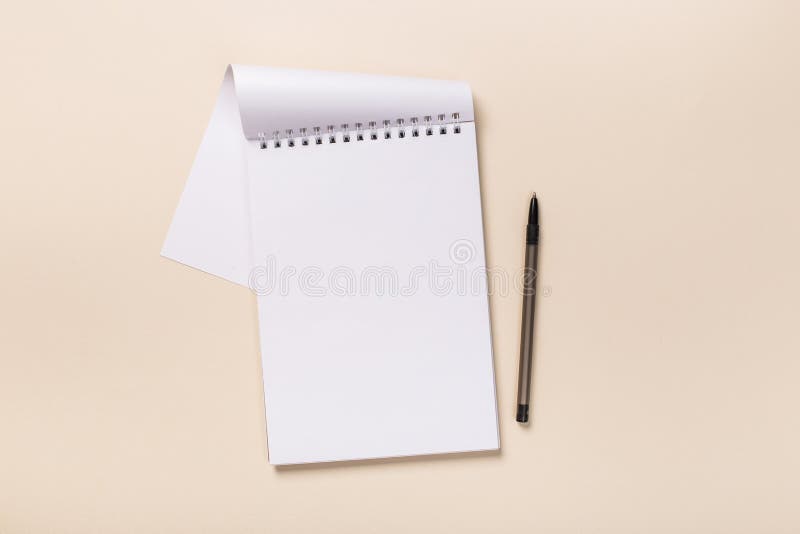 School Notepad and Pen on the Beige Desk. Spiral Notepad on a Table ...