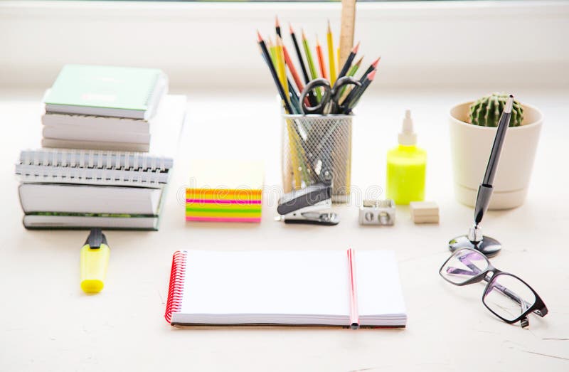 School or Office Table Near the Window. Supplies and Open Notebook ...