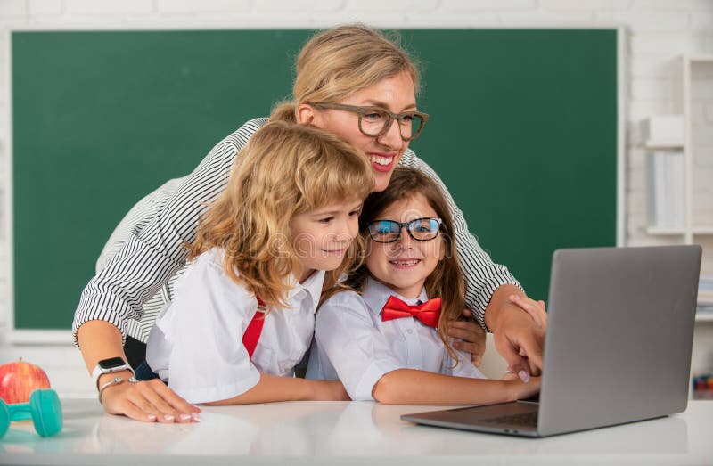 School Pupil with Teacher Learning at Laptop Computer, Studying with ...