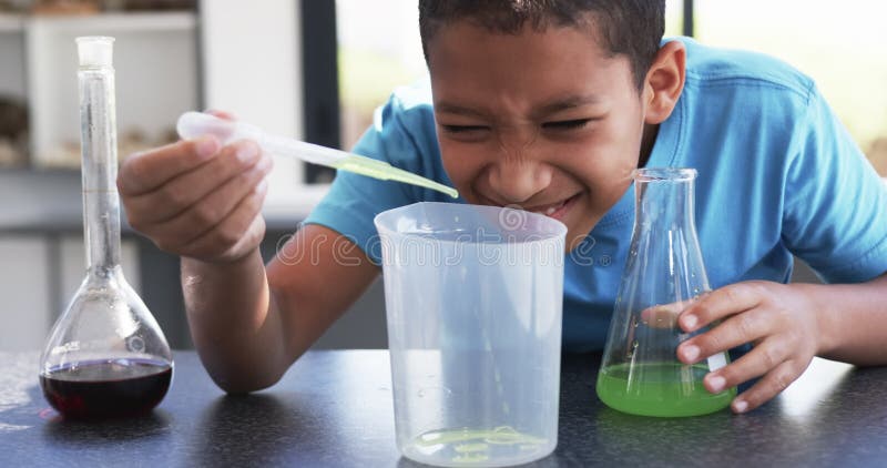 In a School Science Lab Classroom, a Young African American Student ...