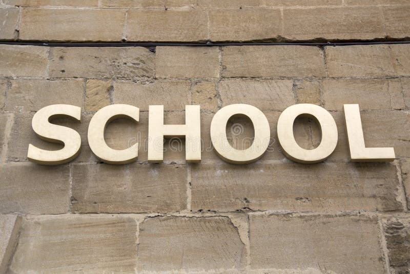 School Sign on Wall stock photo. Image of signage, youth - 191679938