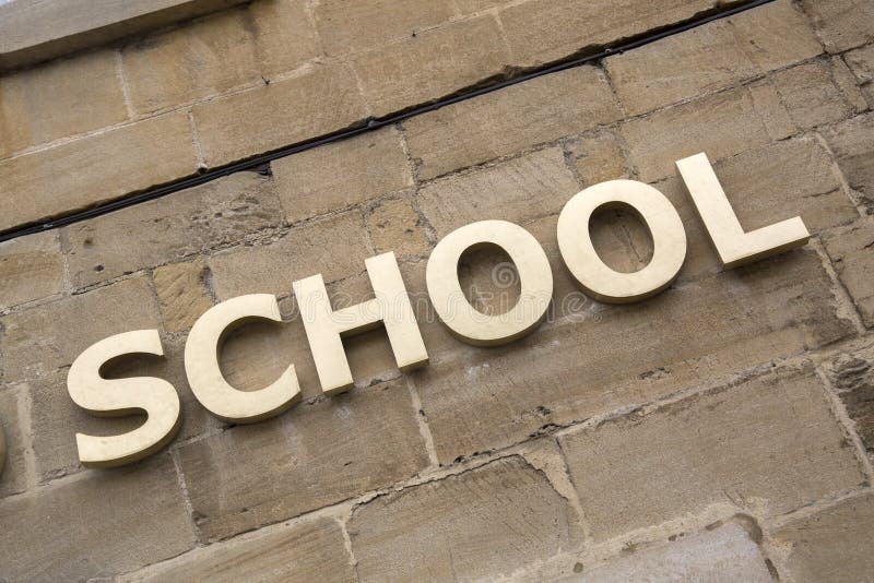 School Sign on Wall stock photo. Image of signage, youth - 191679938