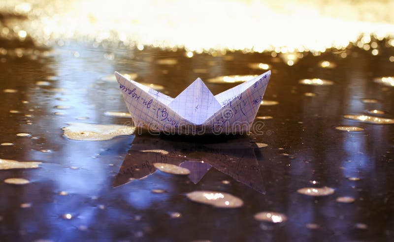 School Small Paper Boat from a Cellular Notebook Floats in the S Stock ...
