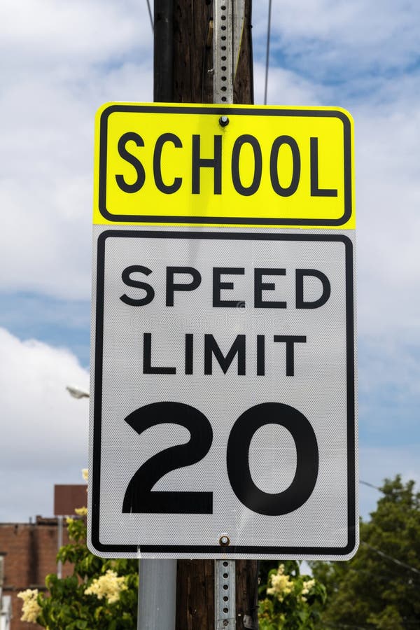 School Speed Limit 20 Sign in a Blue Sky with Clouds. Stock Photo ...