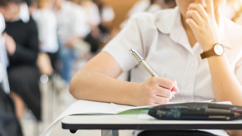 School Student`s Taking Exam, Thinking Hard, Writing Answer in ...