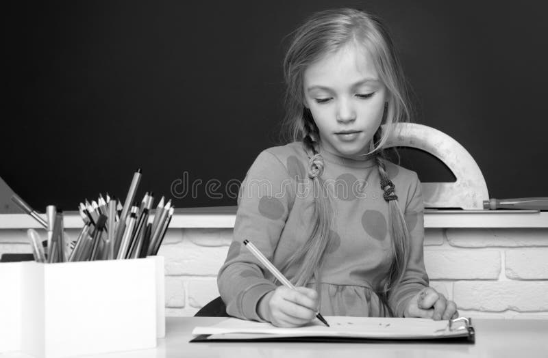 School Student Taking Notes from Book for Study. School Child Near ...