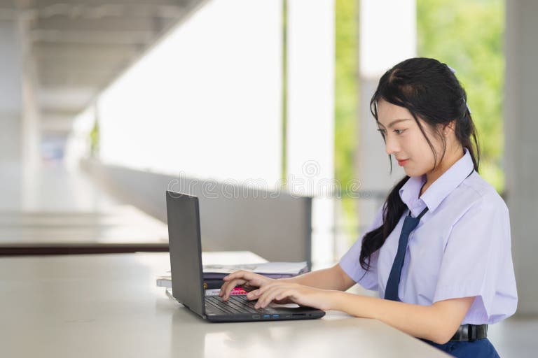 School Student Using Laptop Computer Typing Prompt Do Homework Using AI ...