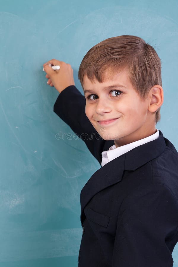 School Student Writing on Blackboard at School Stock Photo - Image of ...