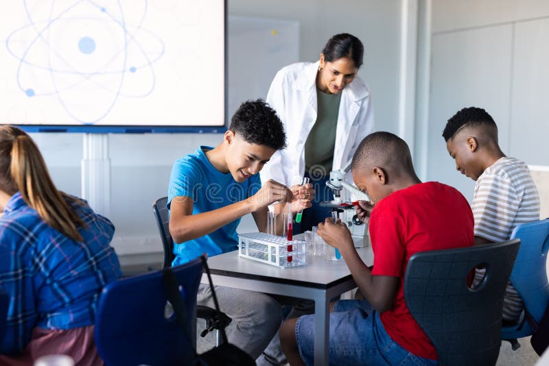In School, Students Conducting Science Experiments with Test Tubes and ...