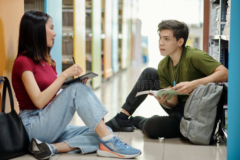School Students Discussing Project Stock Photo - Image of book, smiling ...