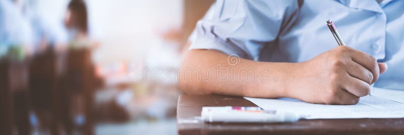 School Students Taking Exam Writing Answer in Classroom with Stress ...