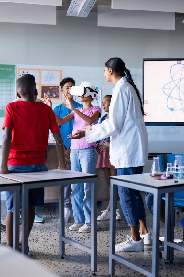 In School, Students Using VR Headset in Classroom with Indian Female ...