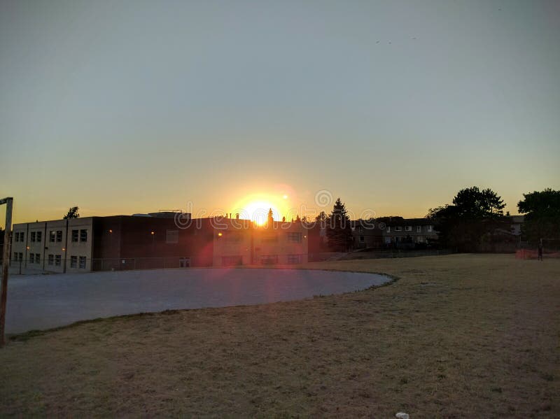 School in sunset stock image. Image of park, lensflare - 74667747