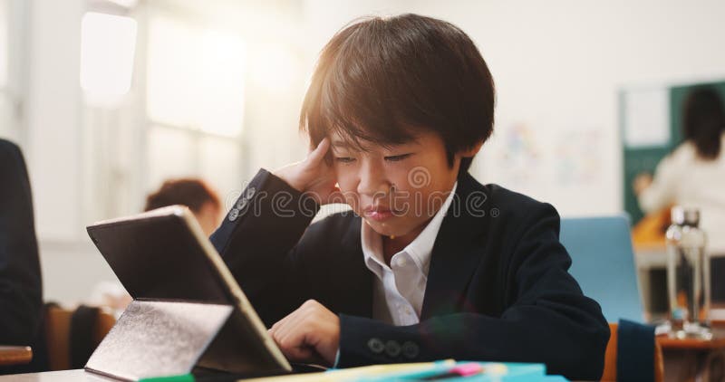School, Tablet and Sad Child with Stress, Leaning and Development in ...
