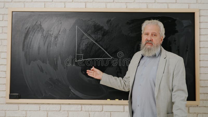 Aged Man College Professor Standing in Classroom in Front of Chalkboard ...