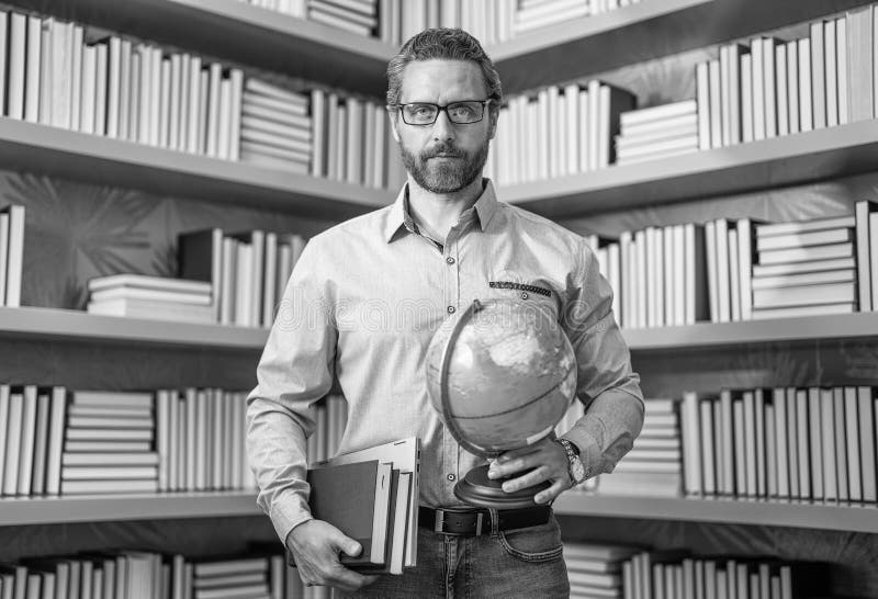 School Teacher Geographer in Classroom Share Knowledge and Education at ...