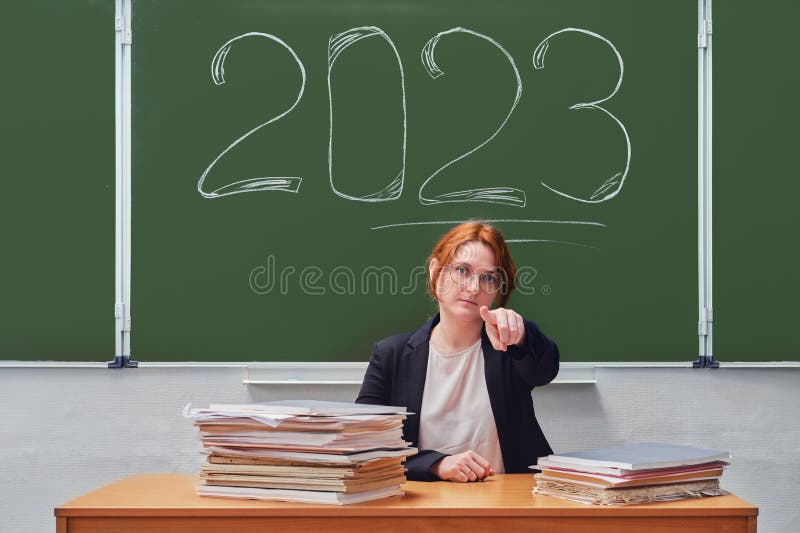 School Teacher Points a Finger Forward, Blackboard with the Text 2023 Y ...