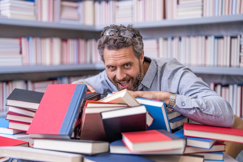 School Teacher Reading Books Getting Knowledge and Education at ...