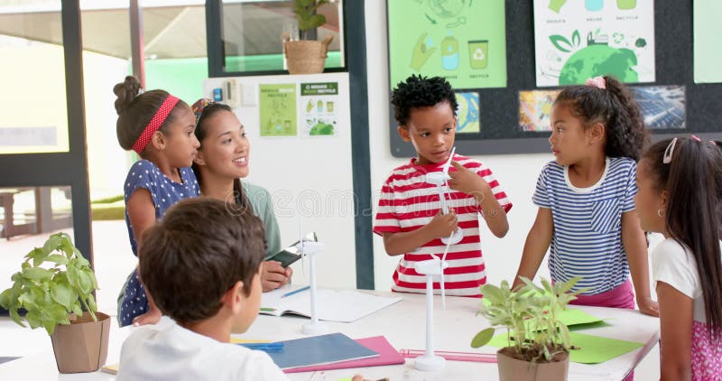 In School, Teacher and Students Discussing Science Project with Wind ...