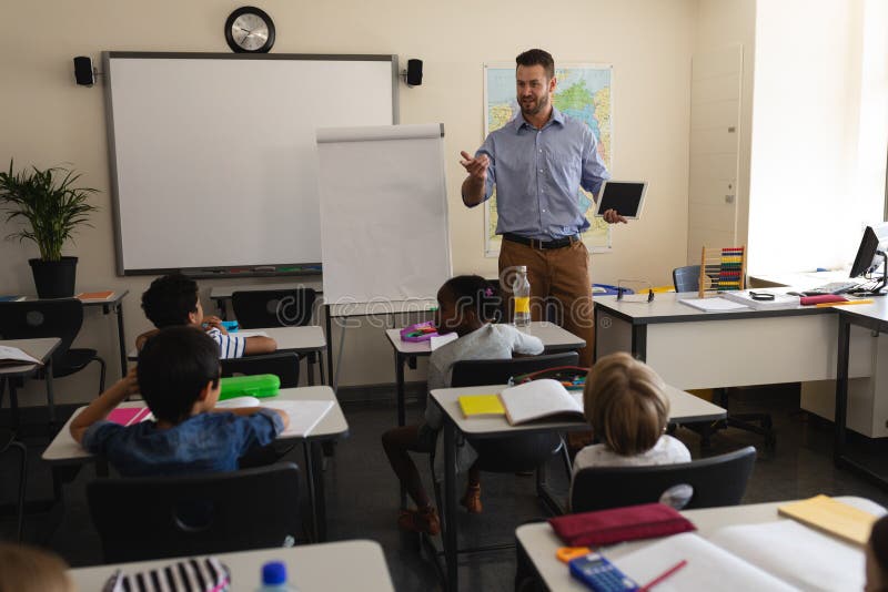School Teacher Teaching in a Classroom Stock Image - Image of ...