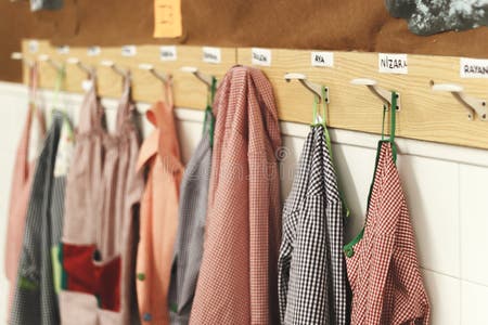 School Uniform Hanging on a Rack in a School. Stock Image - Image of ...