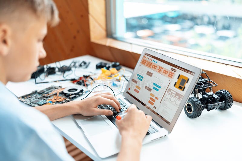 Schoolboy in Blue Shirt Use Laptop Code Robotics Car in STEM Class ...