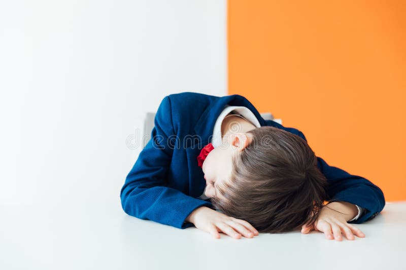 Schoolboy Boy in Business Suit Sleeping Tired at Table Stock Photo ...