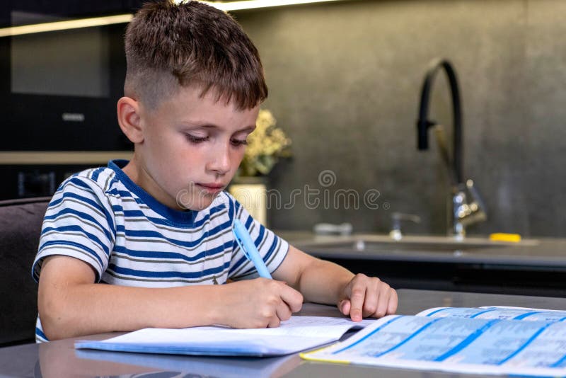 Schoolboy Boy Writes Lessons Kitchen Stock Photos - Free & Royalty-Free ...