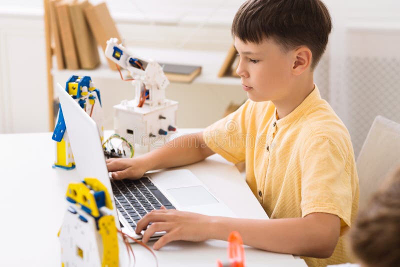 Schoolboy Creating Robotics Project, Typing Plan in Laptop Stock Image ...