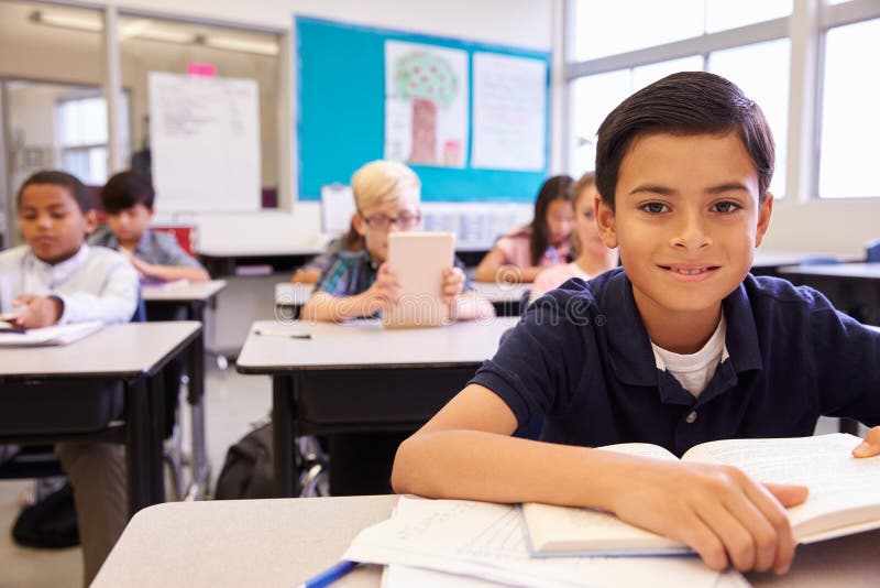 Schoolboy at Desk in an Elementary School Looking To Camera Stock Image ...