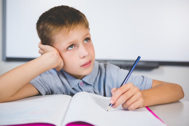 Schoolboy Doing Homework in Classroom Stock Image - Image of learn ...