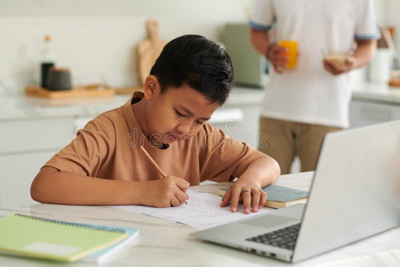Schoolboy Doing Homework in Kitchen Stock Image - Image of positive ...
