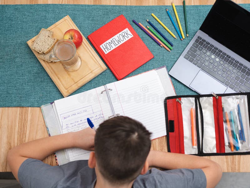 Schoolboy Doing Homework while Taking a Snack. Top View. Back To School ...