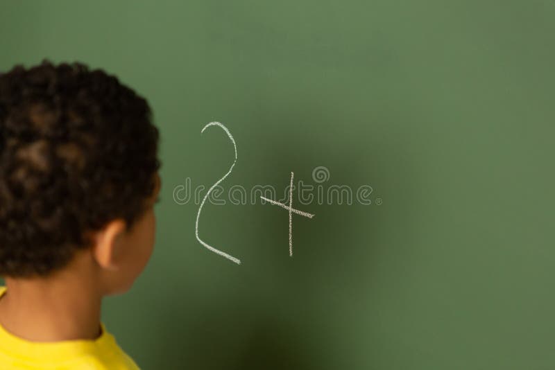 Schoolboy Doing Math on Greenboard in a Classroom Stock Image - Image ...