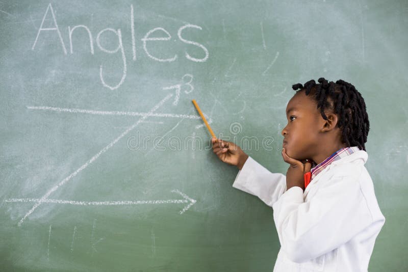 Schoolboy Doing Mathematics on Chalkboard in Classroom Stock Image ...