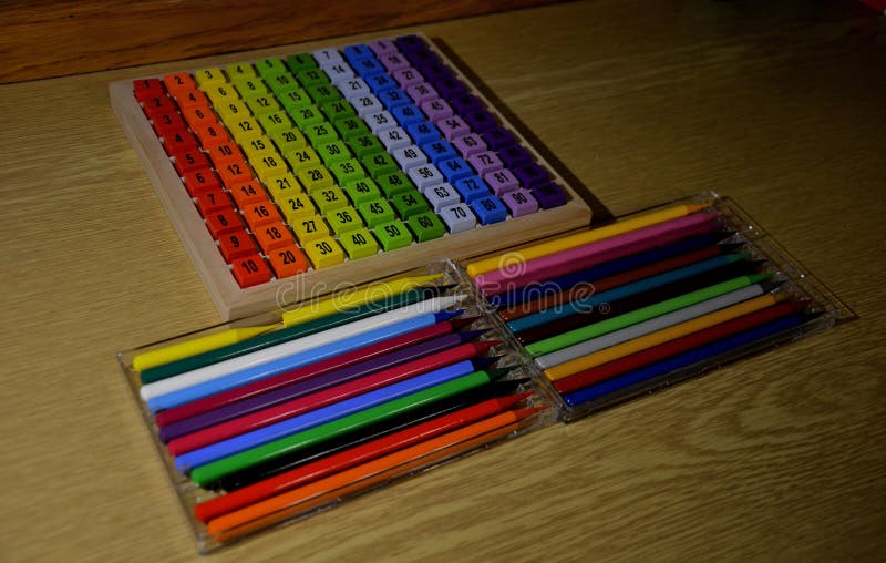 Schoolboy Draws with Colored Crayons and Assembles a Stock Image ...