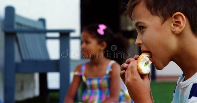 Schoolboy Eating Snacks in Classroom Stock Video - Video of education ...