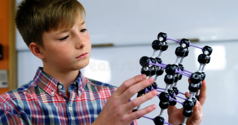 Schoolboy Experimenting Molecule Model in Laboratory at School Stock ...