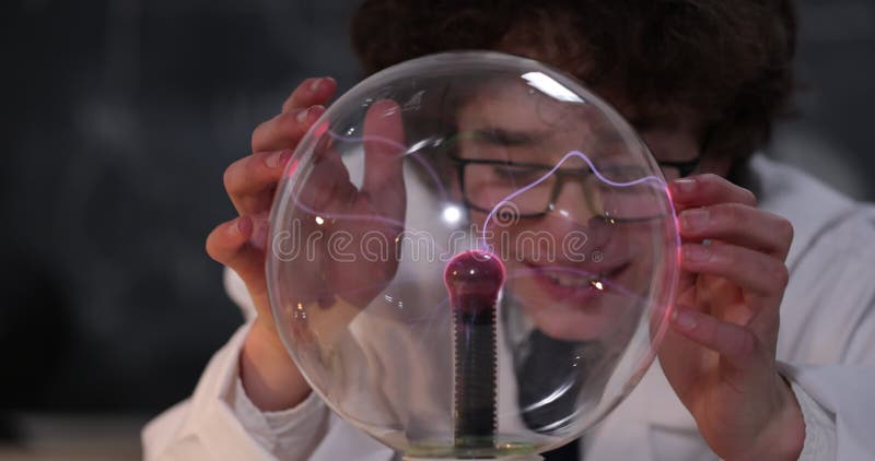 Schoolboy Experimenting in Physics Class. Young Student Doing Physics ...