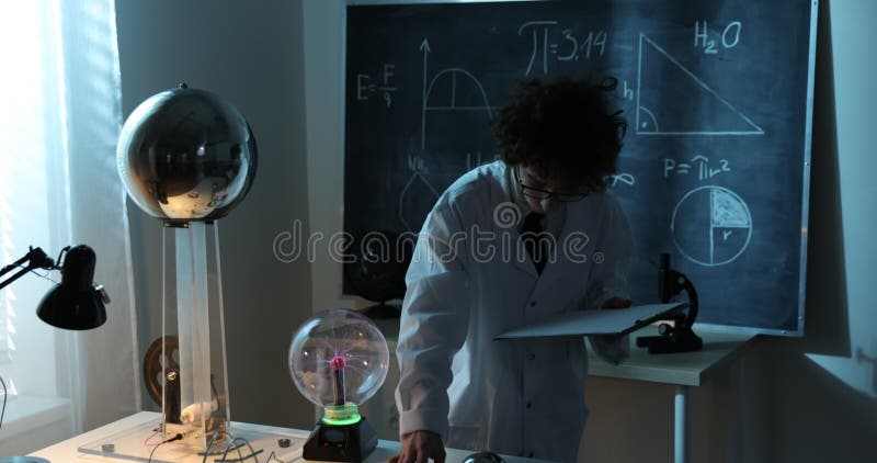 Schoolboy Experimenting in Physics Class. Young Student Doing Physics ...