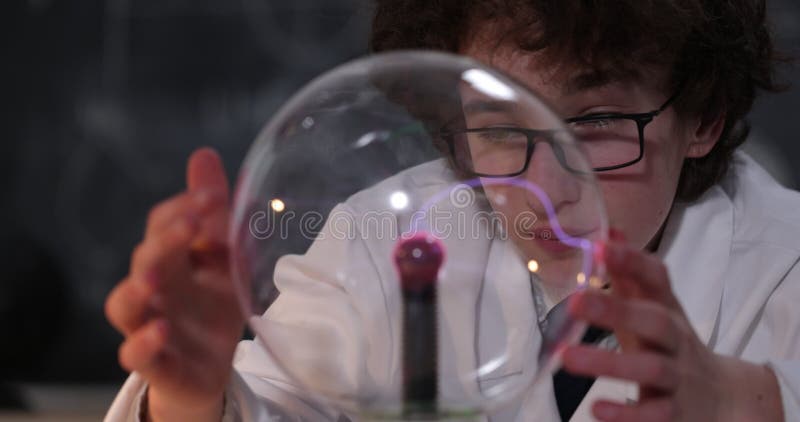 Schoolboy Experimenting in Physics Class. Young Student Doing Physics ...