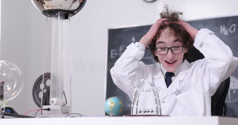 Schoolboy Experimenting in Physics Class. Young Student Doing Physics ...